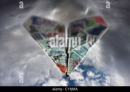 paper postage stamp airplane flying around vintage globe Stock Photo ...