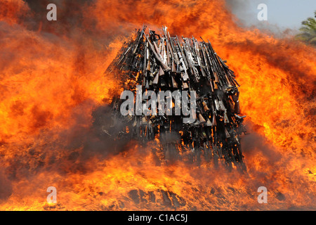 ALL GUN IN A PUFF OF SMOKE A burning pyre, consisting of some 2,400 ...