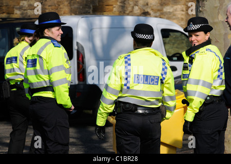 Female Community Support Police Officers walking up a stairway in a ...