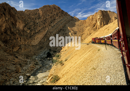 Red Lizard Train Selja Canyon, Tunisia Stock Photo - Alamy