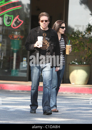 Rock 'n roller George Thorogood, 56, leaves a coffee shop holding hands ...