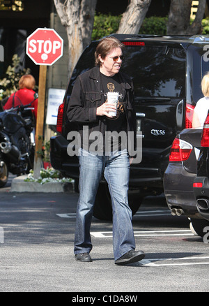 Rock 'n roller George Thorogood, 56, leaves a coffee shop holding hands ...