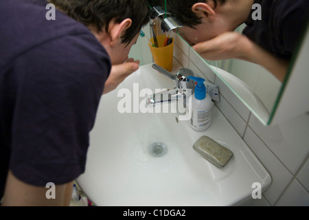 Teenage boy washing face Stock Photo: 30322357 - Alamy