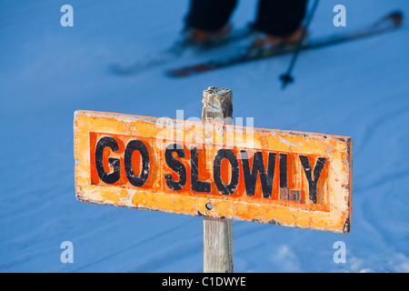 "Slow skiing" warning sign on ski slope in ski resort with majestic ...
