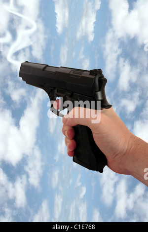 a gun being shot against a cloudy background with clipping path Stock ...