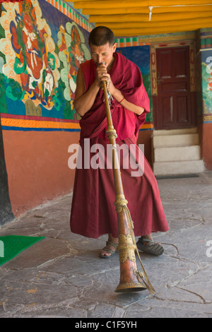 Ladakh Leh monastery monks playing traditional long horns leaning on ...