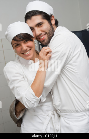 Hispanic bakers smiling in kitchen Stock Photo - Alamy