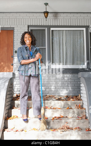 SWEEPING THE FRONT STEPS Stock Photo - Alamy