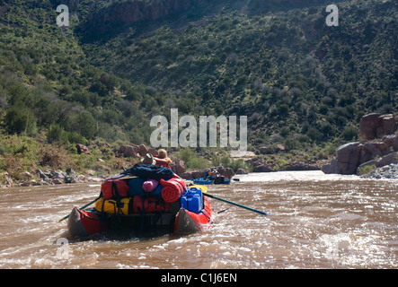 A couple rafting on the Salt River in Arizona, USA on a pontoon boat ...