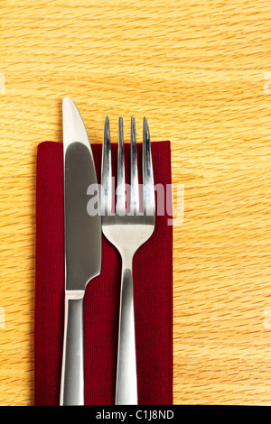 Christmas table place setting with silverware and dark natural ...