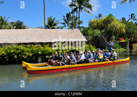 Visitors tour the Polynesian Cultural Center in a canoe raft Stock ...