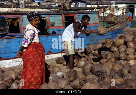 Unloading Cargo of Coconuts from Wooden Dhow on Quay or Quayside ...