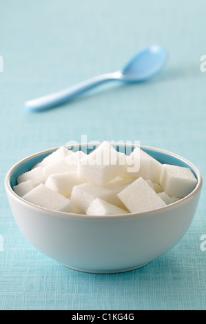 White sugar cubes in bowl on a dark background Stock Photo - Alamy