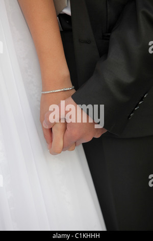 Loving couple holding hands in car close-up Stock Photo - Alamy