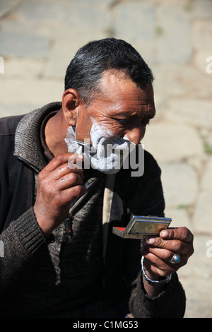 Nepali man shaving himself Nepal Himalaya Stock Photo - Alamy