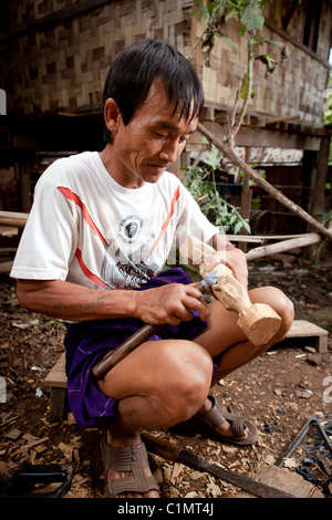 Karen Long Neck man carving Long neck wooden doll, Huay Pu Keng Stock ...