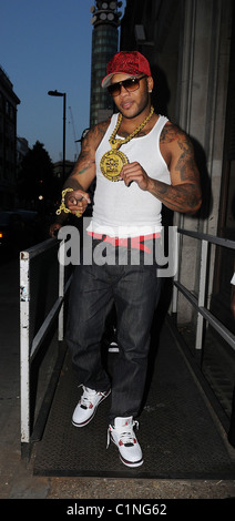 Flo Rida at Radio 1 wearing a huge gold medallion inscribed with his ...