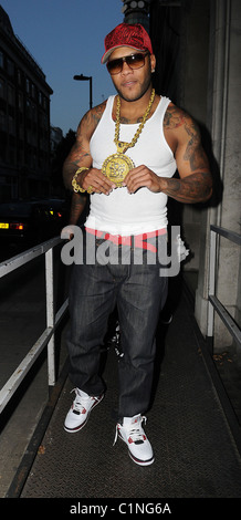 Flo Rida at Radio 1 wearing a huge gold medallion inscribed with his ...