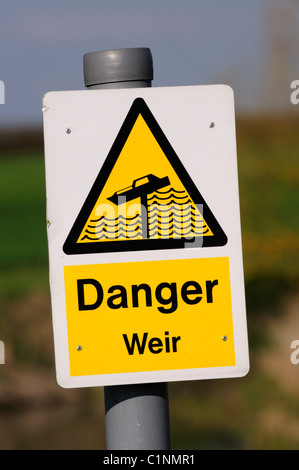 Warning sign of a weir Stock Photo - Alamy