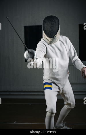 Male fencer in action Stock Photo - Alamy