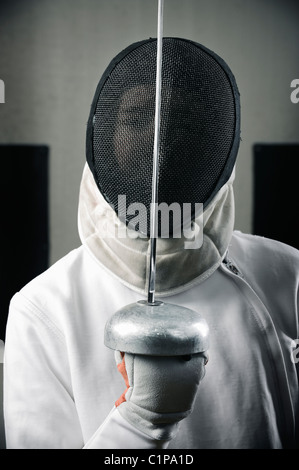 Portrait of fencer wearing face guard in sports hall Stock Photo - Alamy