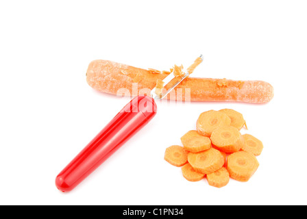 Peeling ripe orange carrot with vegetable peeler. Flat lay view. Fresh ...