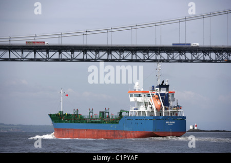 Boat sailing under Forth Road Bridge in a beam of light Stock Photo - Alamy