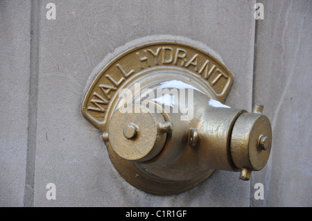 Wall mounted fire hydrant for emergency use with Dutch fire sign Stock ...