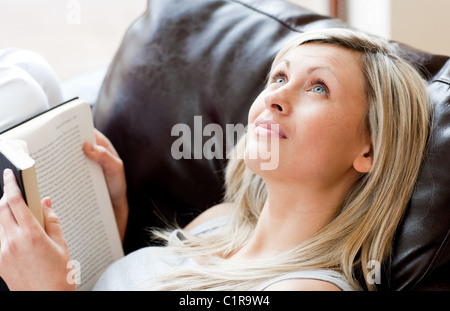Beautiful young surprised woman read mobile phone dressed in autumn ...