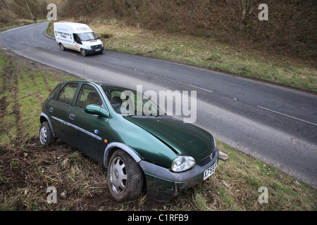 A crashed Vauxhall Corsa car is left at the side of the road near ...