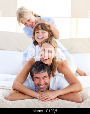 Beautiful happy family is having fun with dog outdoors. Cute family ...