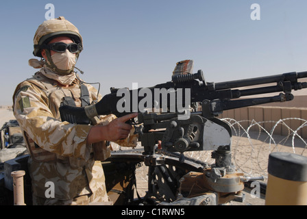 A British Army soldier mans the mounted machine gun on a land rover ...