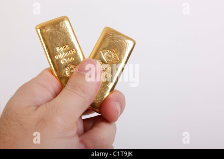 gold bars in hand Stock Photo - Alamy