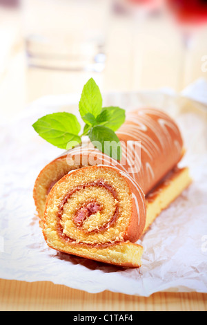 Slice of Jam swiss roll cake Stock Photo - Alamy