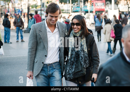 Smiling couple on the streets of Spain against blurred background Stock ...