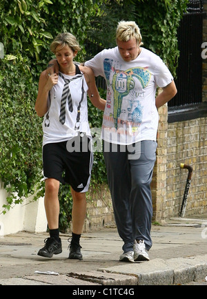Natalie Appleton and Liam Howlett walk back from their local park after ...