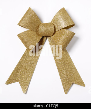 with gold ribbon and bow for a birthday or holiday on a brown wooden ...