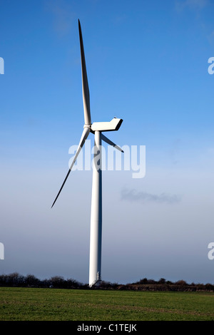 White long blades of wind turbine loaded and lashed by slings, chains and tensioner on the heavy ...