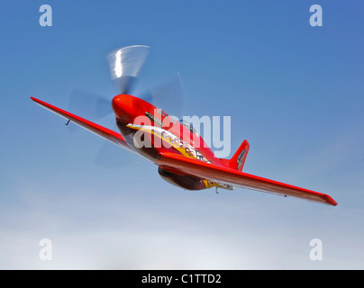 A Dago Red P-51G Mustang modified for competitive air racing, in flight ...