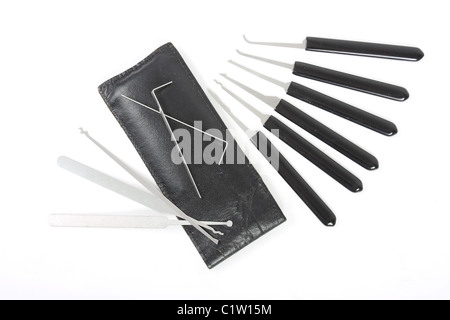A set of amateur and professional lock picks; including a steel rake ...