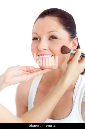 Face powder being applied to young woman's forehead Stock Photo - Alamy