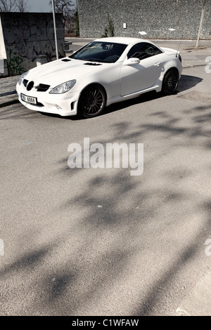 White Mercedes-Benz SLK sports car parked in the street Stock Photo - Alamy