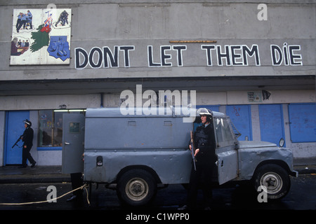 RUC officer armed patrolling street of Belfast during riots immediately ...