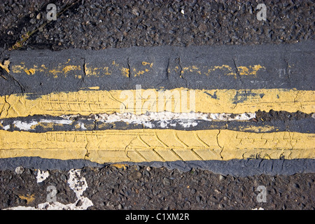 Road gutter with double yellow lines, UK Stock Photo - Alamy