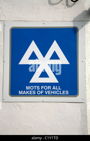 Blue and white signs for MOT vehicle testing station, catalysts tested ...