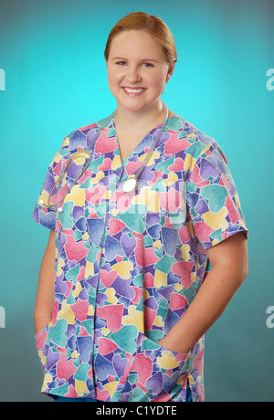 Smiling Attractive Female Nurse Wearing Scrubs Stock Photo - Alamy