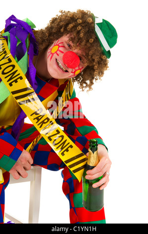 Clown is drinking with a bottle of wine Stock Photo - Alamy