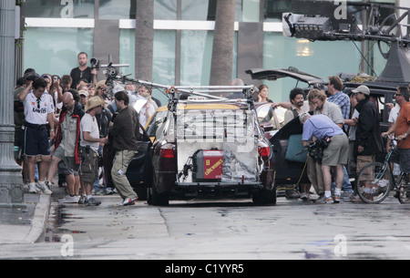 Leonardo DiCaprio driving a car in the rain while filming a scene for ...