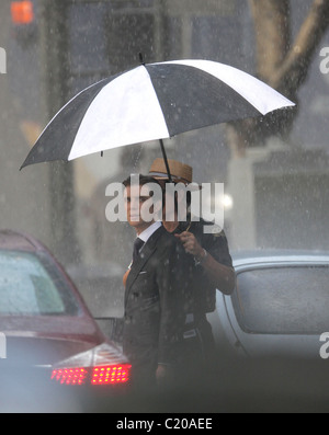 Cillian Murphy shoots a scene in the rain on the set of his new movie ...