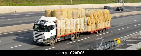 Front and side view of trailer & flatbed hgv lorry truck carrying large ...